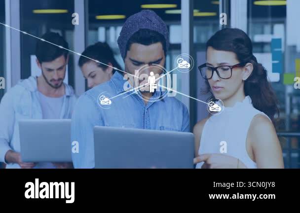 Business colleagues examining laptop, icon appearing and expanding ...