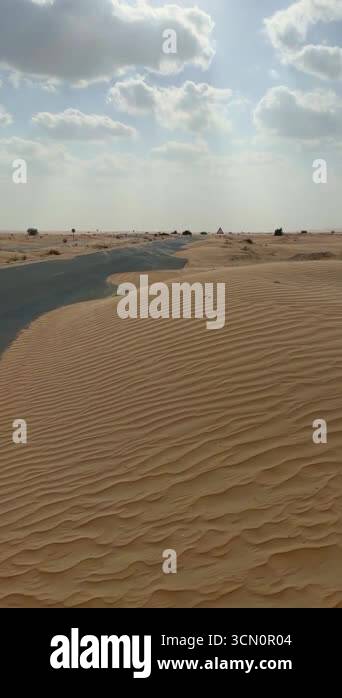 desert dune forms as strong winds carry fine sand particles across the ...