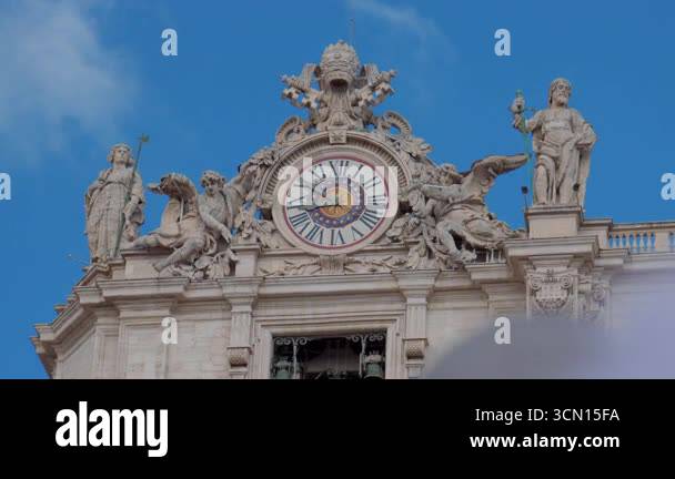 Rome, ITALY, JULY 30th, 2025 - Ornate clock on St. Peters Basilica with ...