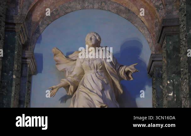 Rome, ITALY, JULY 30th, 2025 - Marble statue of saint with arms ...