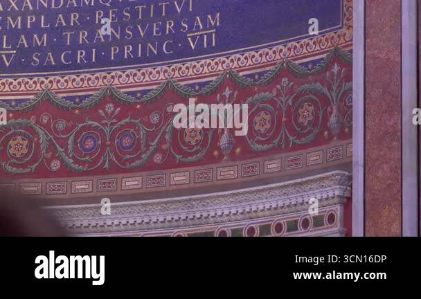 Rome, ITALY, JULY 30th, 2025 - Detailed red and blue mosaic wall with ...