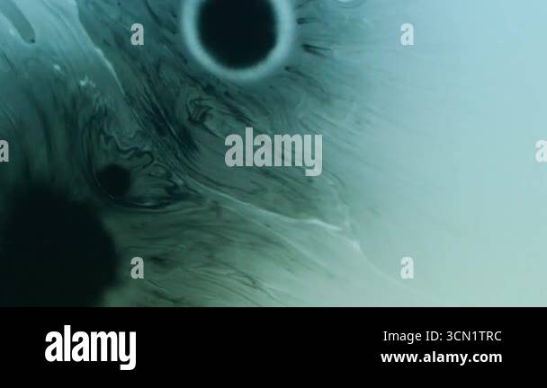 Paint stain fluid. Ink spill. Blue turquoise dye dripping on wet blur ...