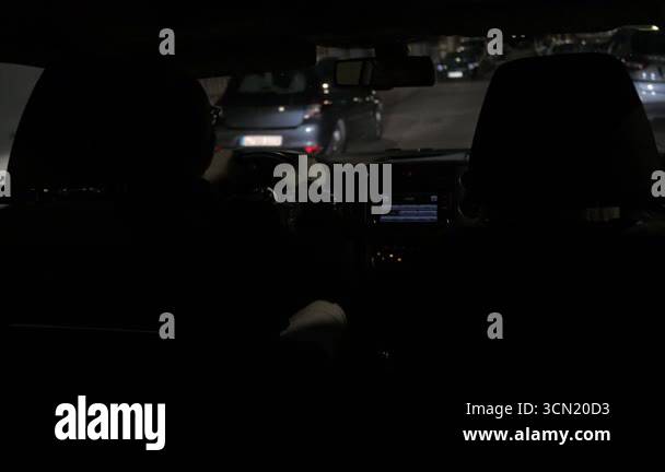 A view of a car interior at night, highlighting the illuminated ...