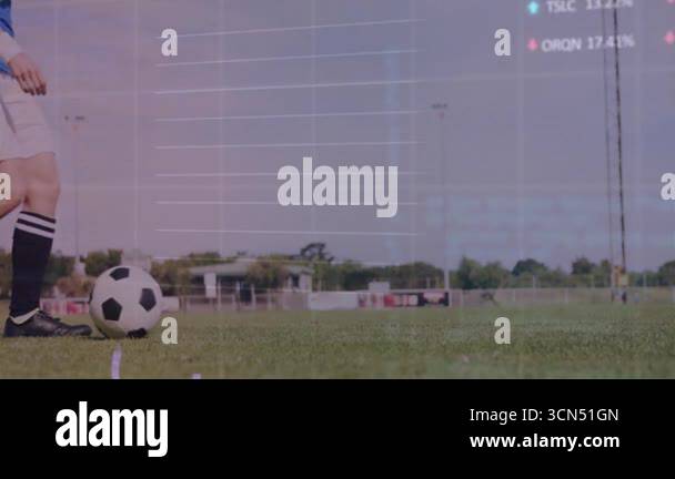 Female athlete tapping soccer ball on turf pitch and activating ...