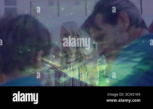 Father leaning feeding boy with spatula while mother clapping and grid ...