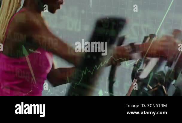 Woman adjusting elliptical settings and tracking fitness progress with ...