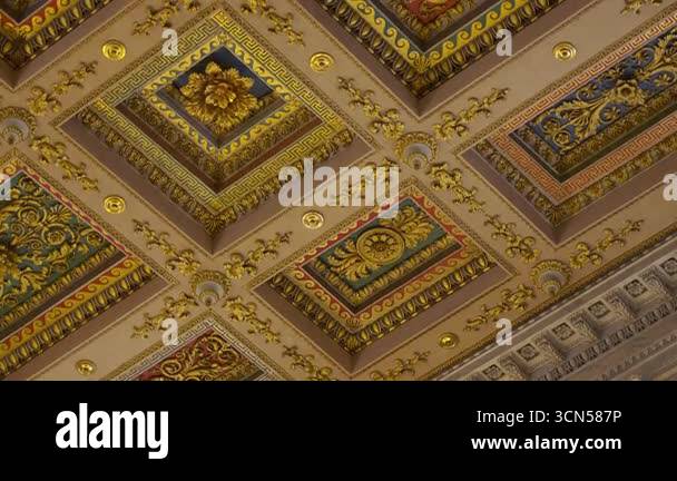 Rome, ITALY, JULY 30th, 2025 - Ornate coffered ceiling with gold floral ...