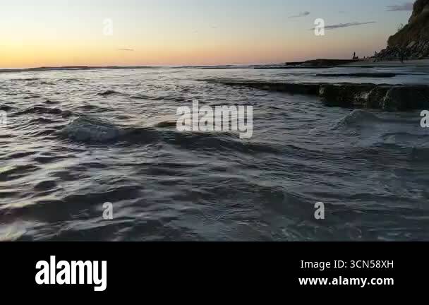 Southern California beach scenes 4K video at sunset with tide pools ...