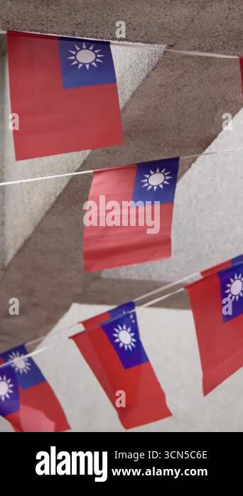 Vertical Slow motion of Taiwan flags hanging in rows outdoors ...