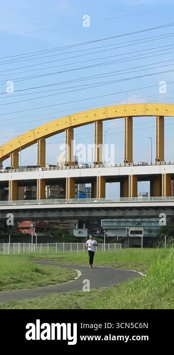 Road runner caucasian man running on road in Taipe city. Jogging a ...