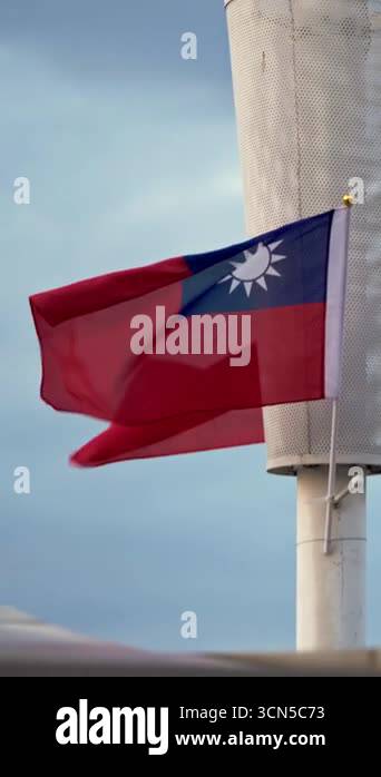 Vertical Slow motion of Taiwan national flag waving prominently on a ...