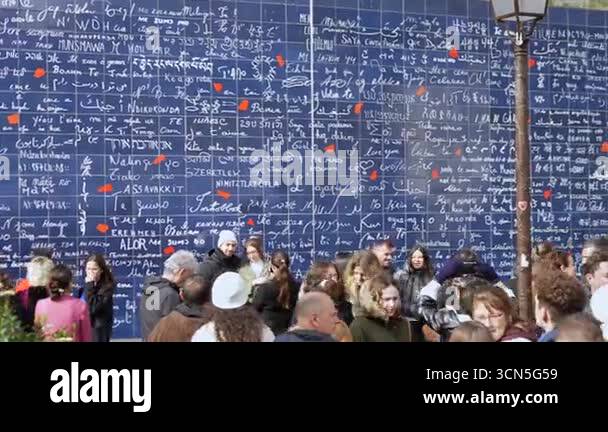 Wide shot of the famous I Love You Wall in Montmartre with groups of ...