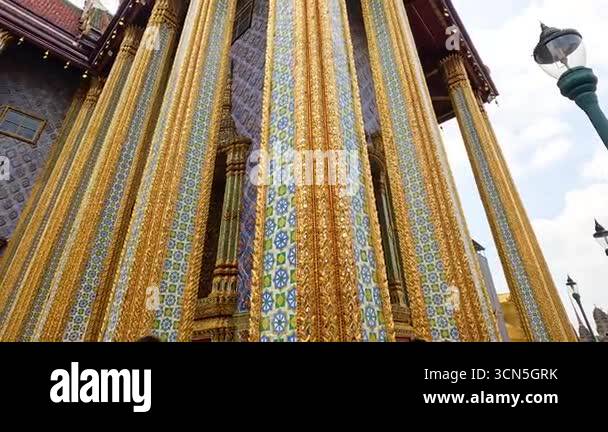 A dynamic view of Wat Phra Kaew's ornate golden pagoda in Bangkok ...