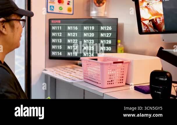 Person receiving receipt at a service counter Stock Video Footage - Alamy
