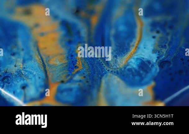 Bubble paint. Blob flow. Defocused blue yellow color pigment round oil ...