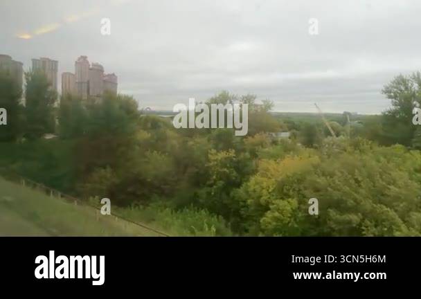 Exploring urban scenery through a train window on an overcast day Stock ...
