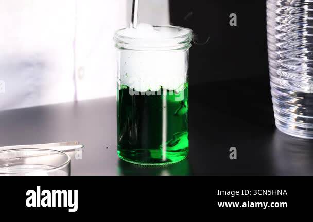 Dry ice experiment producing smoke and bubbles Stock Video Footage - Alamy
