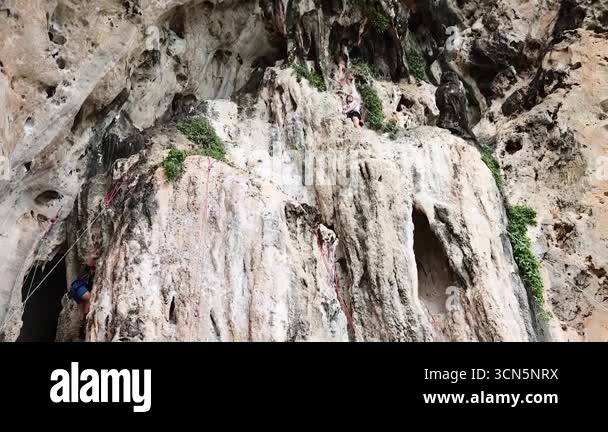 Climbers scale limestone cliffs in Krabi, Thailand Stock Video Footage ...