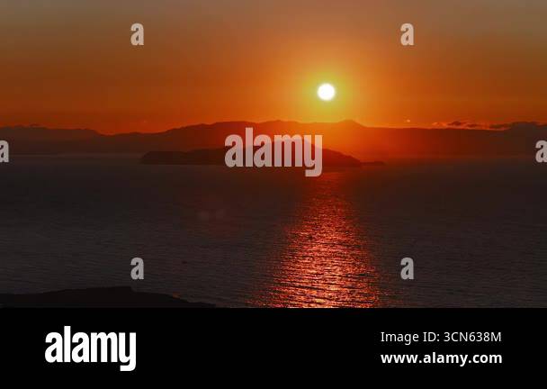 Aerial view of a sunset near Chania, Crete, Greece. The sun casts ...