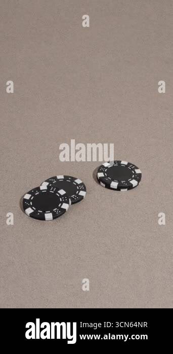 Black and white poker chips are arranged in a stop motion sequence ...