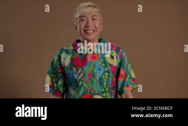 Video clip of a young adult male jumping up and down joyfully in the ...