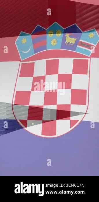 Waving Croatian flag displaying coat of arms prominently in center with ...