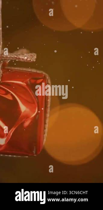 Animation of falling snowflakes over candles and christmas decoration ...