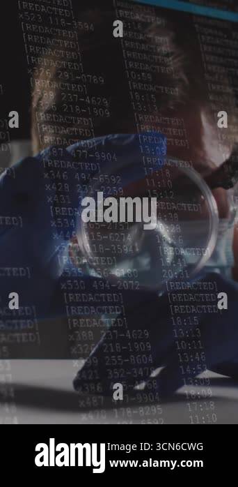 Scientist examining sample with magnifying glass over redacted data ...