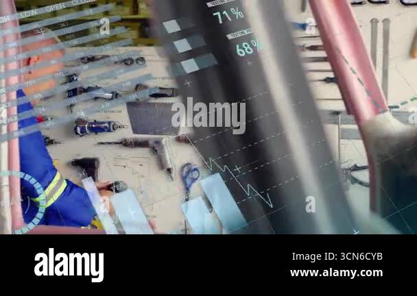 Mechanic testing tools by inspecting drill chuck and driver under ...