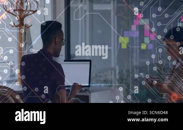 Colleagues tapping tablet, typing laptop sharing data driving business ...