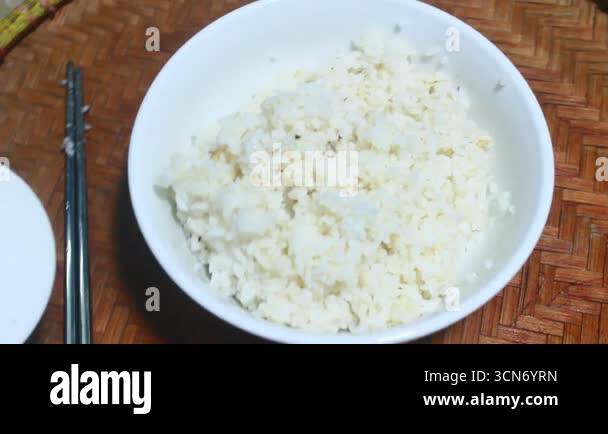 bowl of cooked rice Stock Video Footage - Alamy