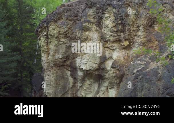 Sulfurous rock formations formed in the area of a volcano where sulfur ...