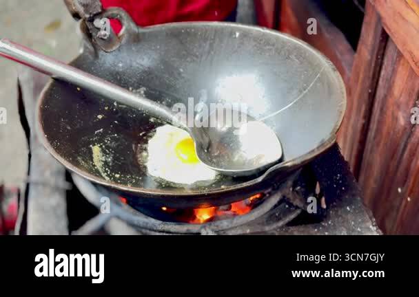Traditional process of cooking boiling noodles with egg and vegetables ...