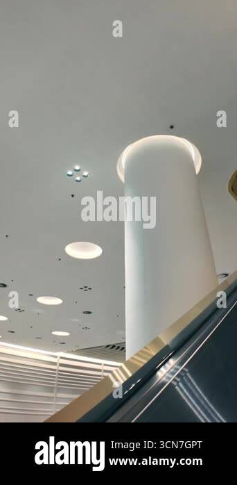 ascending on escalator with modern interior, sleek design and elegant ...