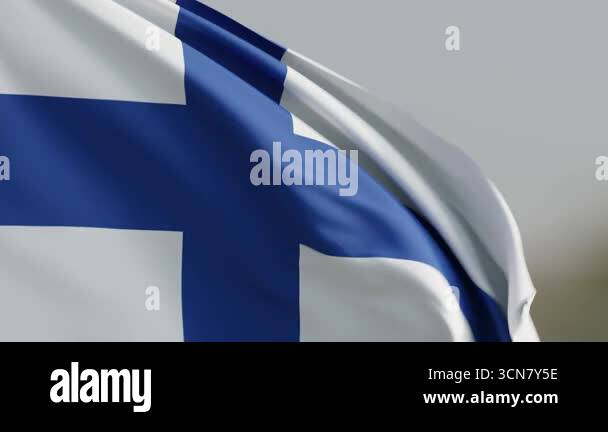 The national flag of Finland waves gently, displaying its distinct blue ...