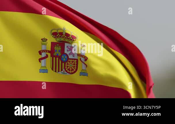 Dynamic depiction of the Spanish flag, featuring its iconic red and ...