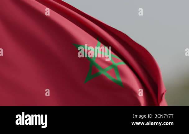Close up view of the Moroccan national flag gracefully waving in the ...