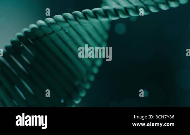 Illustrates a captivating slow rotation of a dark teal green DNA double ...