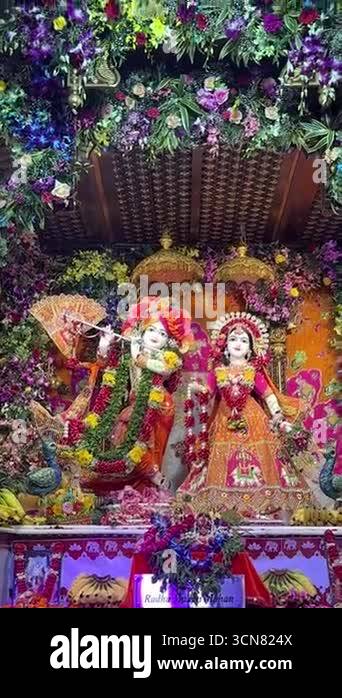 Colorful sculpture of hindu god Krishna and goddess radha decorated ...
