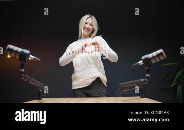 Engaging female host shares insights in a podcast studio focused on ...