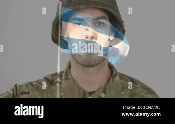 Military soldier lifting hand into salute upon waving flag overlay ...