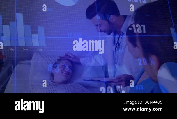 Doctor approaching bedside and reviewing chart while reassuring patient ...