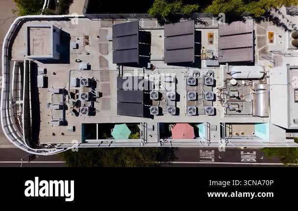 Aerial vertical drone view of a modern building rooftop in Los Angeles ...
