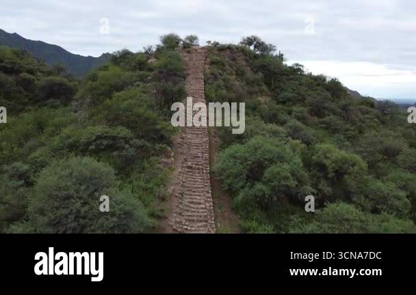 Inca stone staircase climbing a ceremonial mound. View from the air at ...
