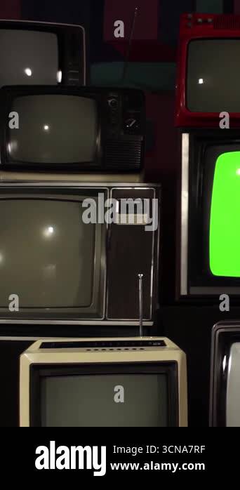 Retro TV with Green Screen in the Center of a Massive Stack of Old ...