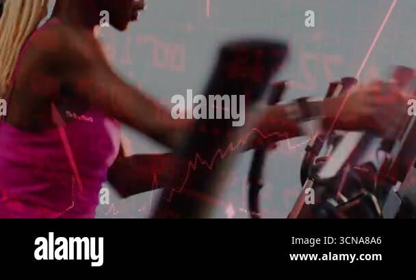 Fitness athlete stepping onto machine tapping console, pedaling showing ...