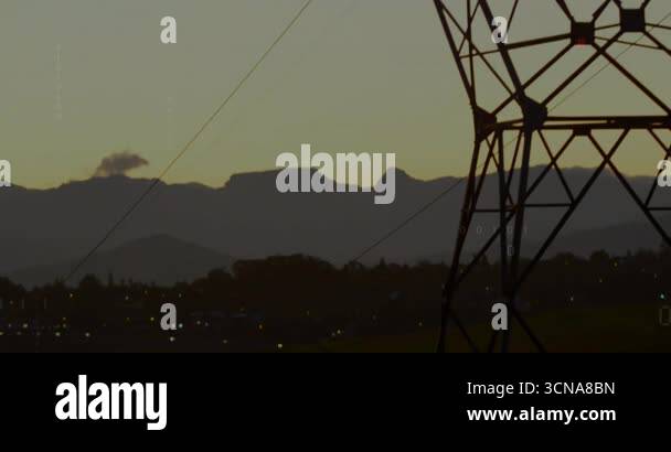 Faint binary streams appearing behind transmission pylon, floating into ...
