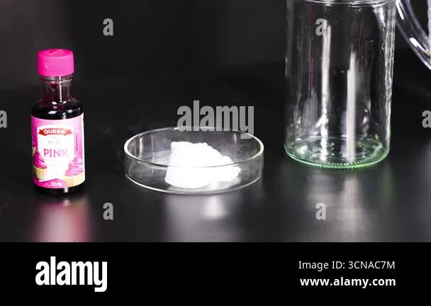 A sequence showing dry ice sublimation with a pink liquid in a ...