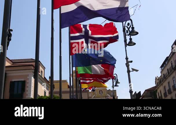 Multiple flags waving in the wind Stock Video Footage - Alamy