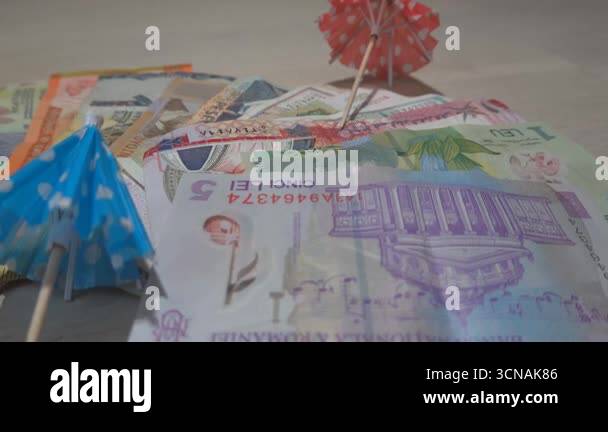 Stockholm, Sweden A pile of paper currency from exotic countries like ...